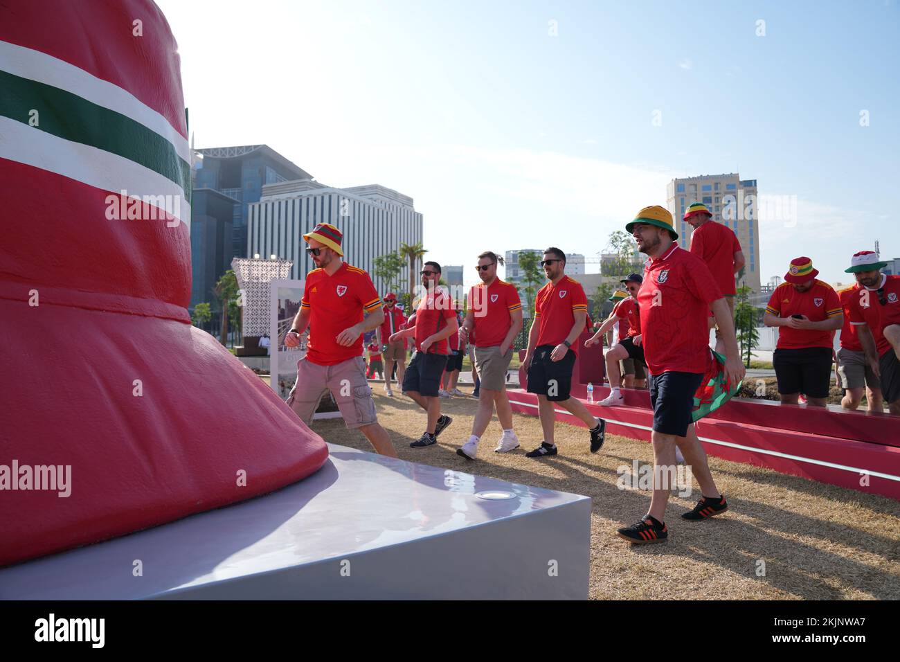 Wales fans gather next to an oversized version of a bucket hat ...