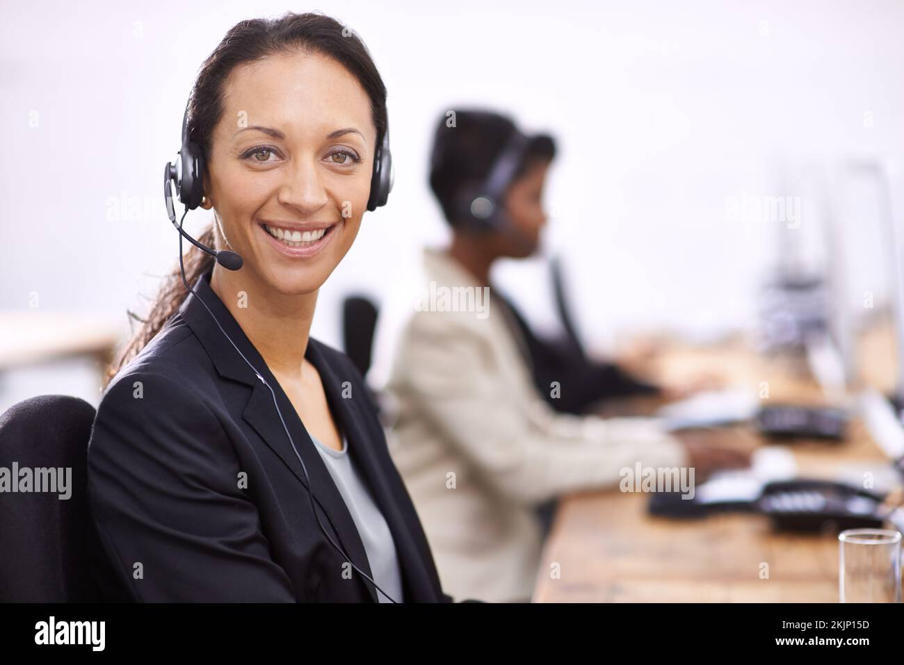 Shell reach her target today. an attractive female call center ...