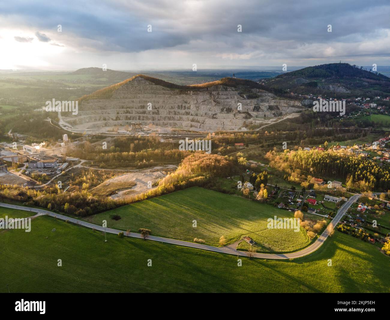 An aerial landscape of the Abandoned Stone Quarry with grass fields in Lestina, Czech Stock ...