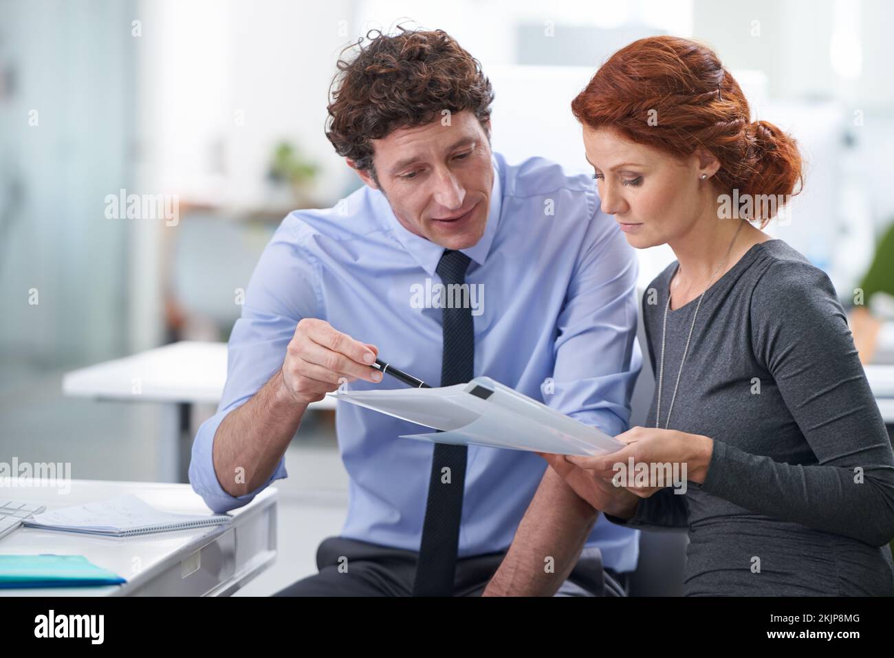Redhead female explaining hi-res stock photography and images - Alamy