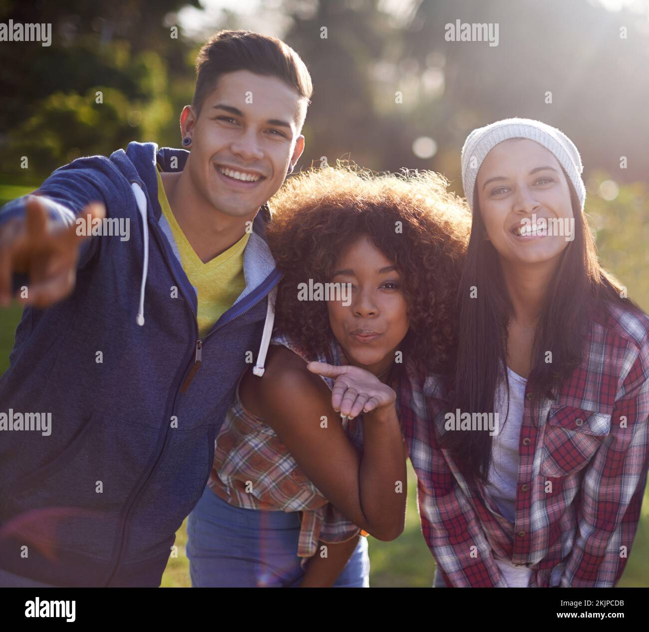Come out and play. a young group of friends enjoying the outdoors Stock ...