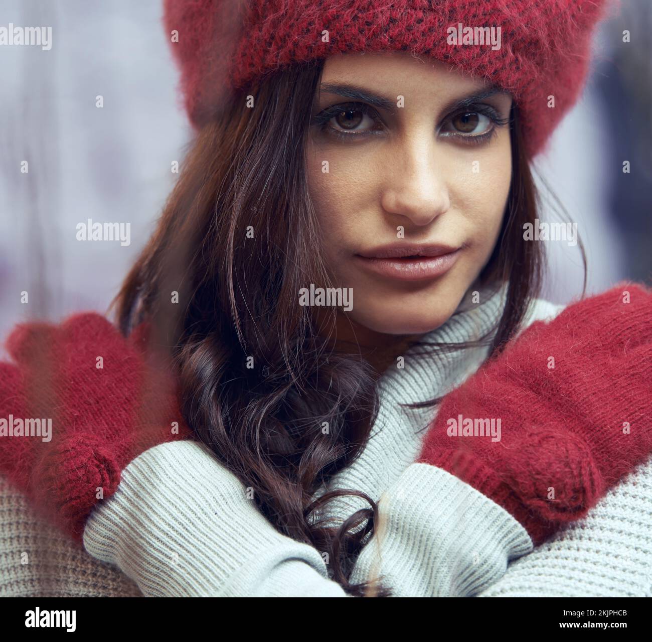 Loving the first snowfall. an attractive woman enjoying herself outside ...