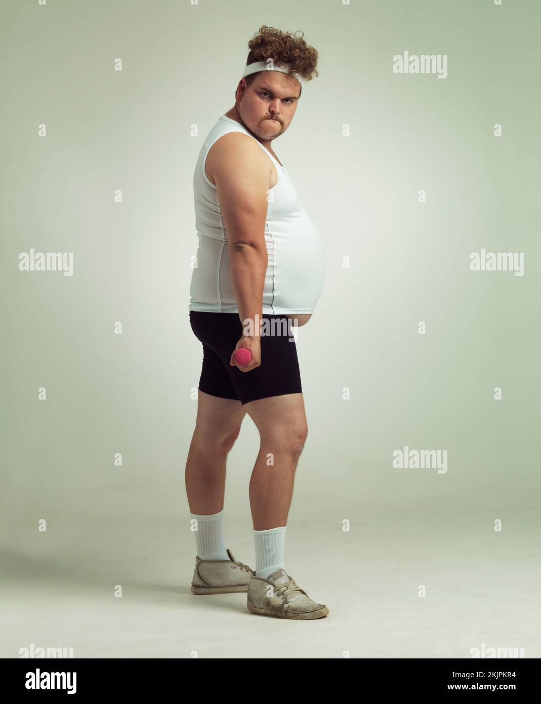 This is as easy as 1, 2, 3. Portrait of a overweight man exercising ...