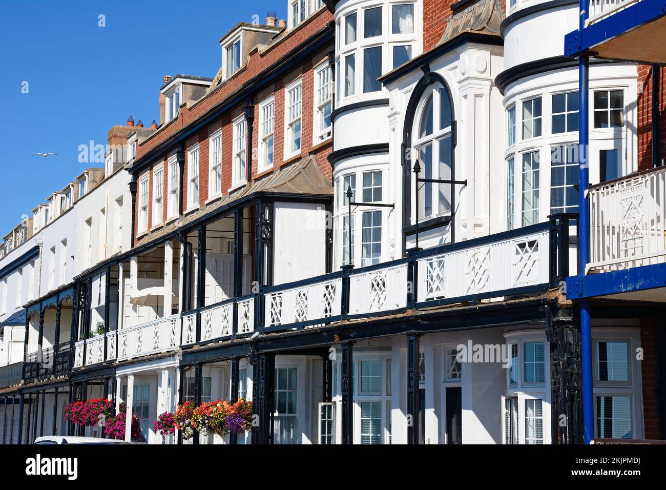 Front view of Hotel buildings with pretty balconies alongside the ...