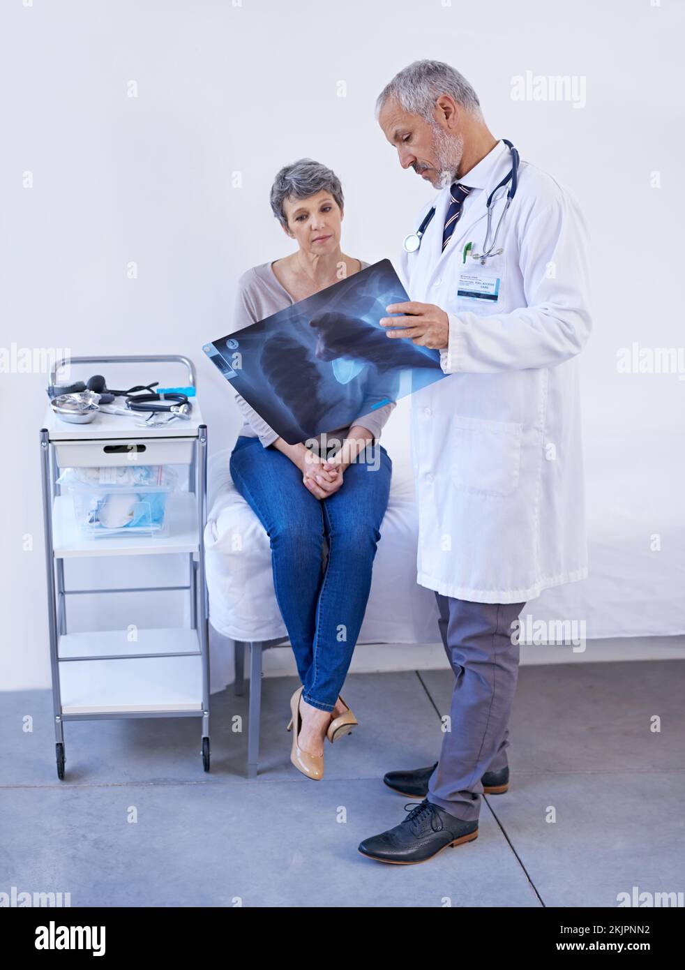 Complex problems simplified. Full length shot of a doctor explaining a ...