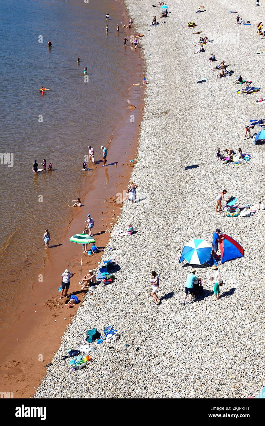 Elevated view of tourists relaxing on Jacobs Ladder beach, Sidmouth ...