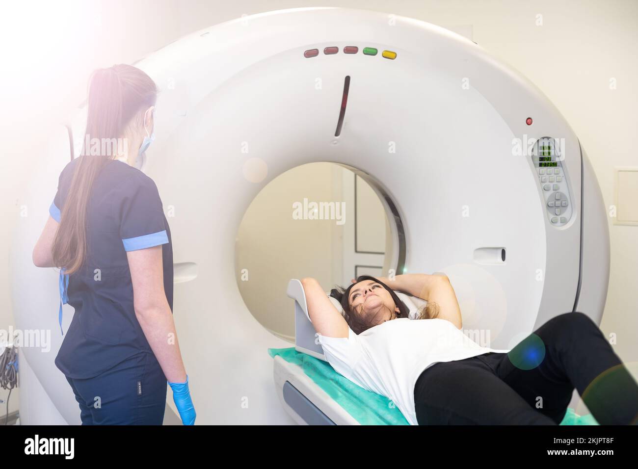 Radiologic technician and Patient being scanned and diagnosed on ...