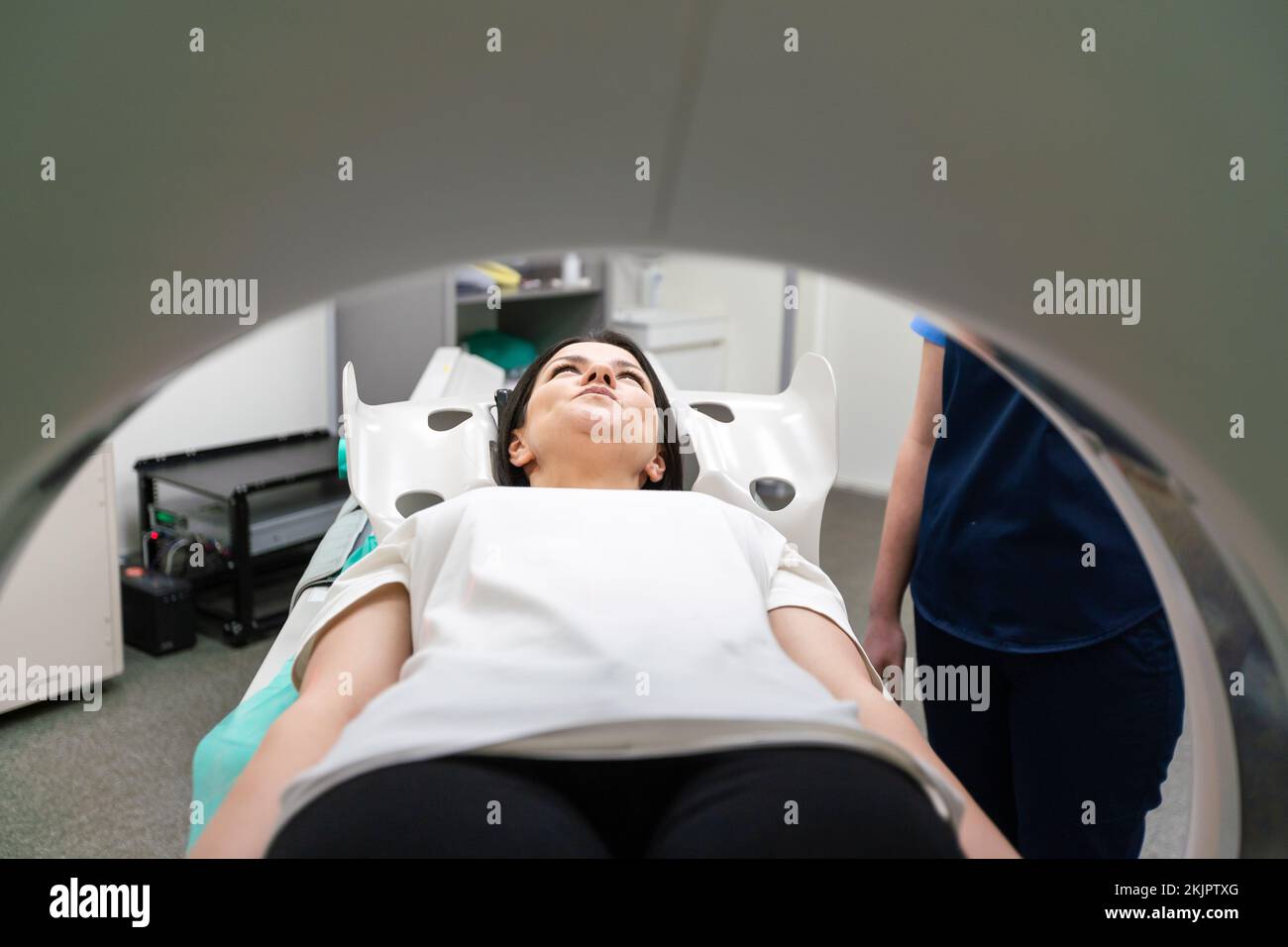 Radiologic technician and Patient being scanned and diagnosed on ...