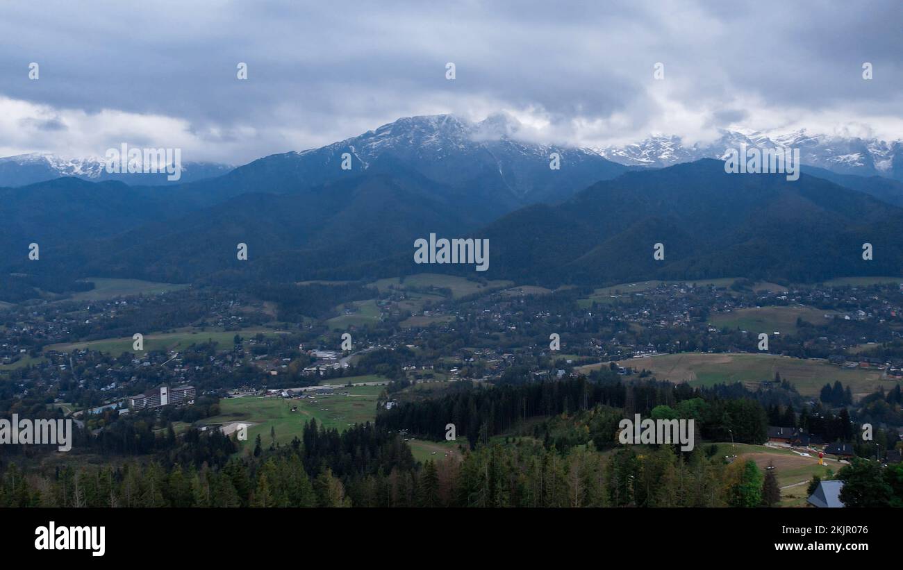 Aerial view of Zakopane town underneath Tatra Mountains taken from the ...
