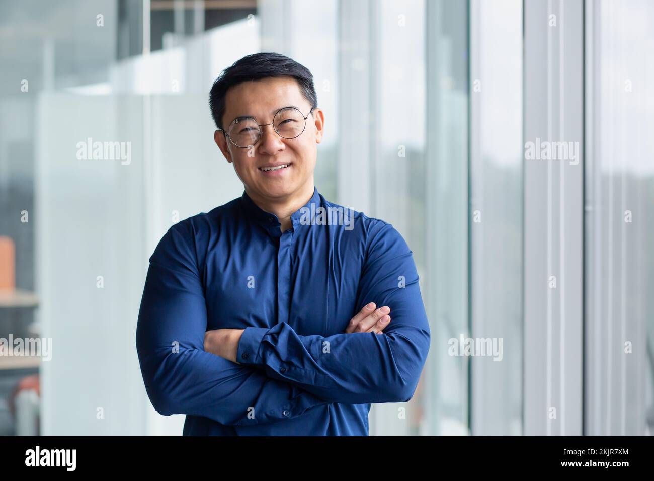 Portrait of successful mature boss, senior businessman in glasses Asian ...