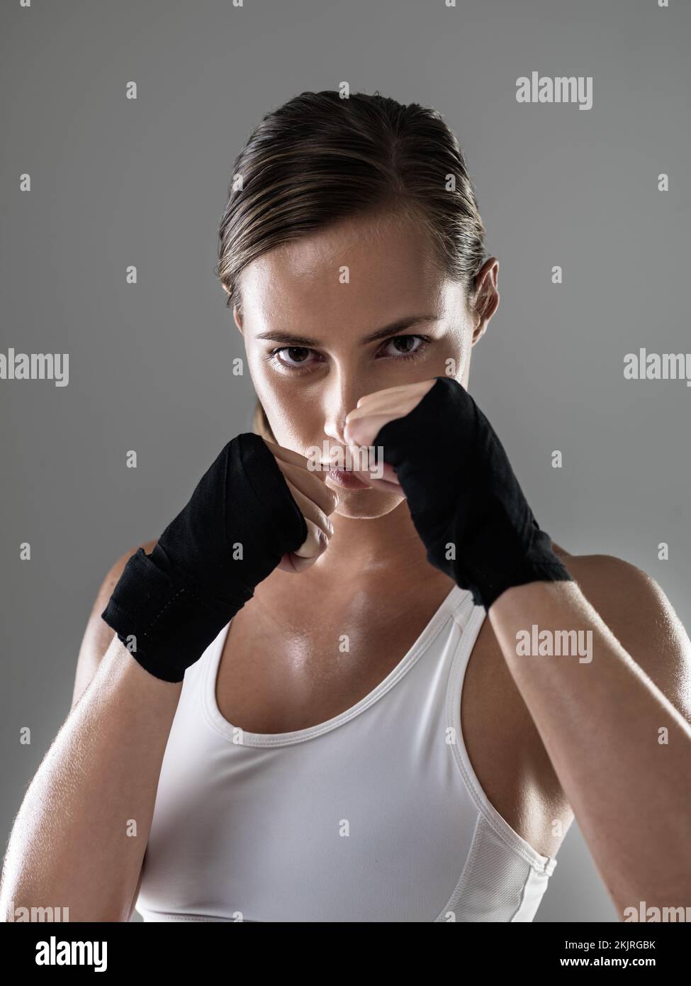 Shes winning the fight against fat. Portrait of a young woman with her ...