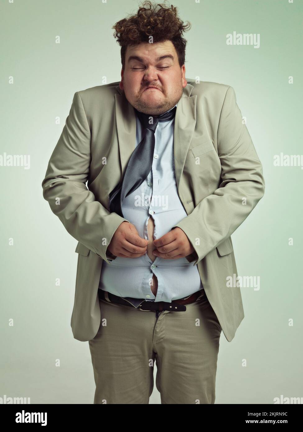 I dont need to breathe today. an overweight man in a suit trying to ...