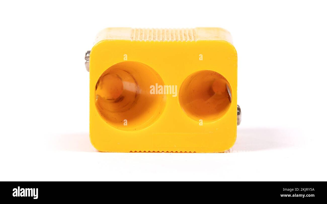 Close up old yellow pencil sharpener, isolated on white background ...