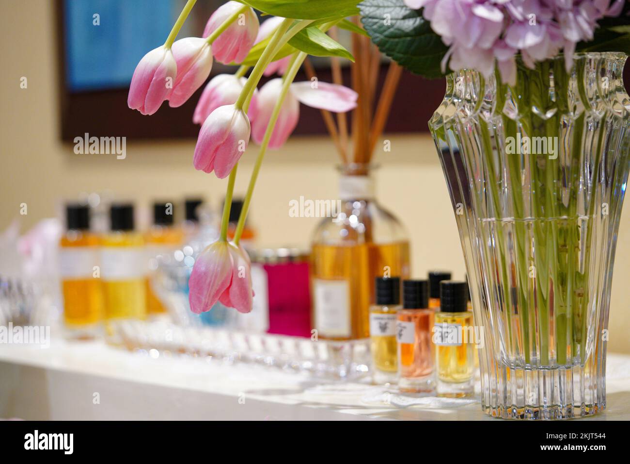 Elegant flower vas and luxury perfume at the reception desk Stock Photo ...