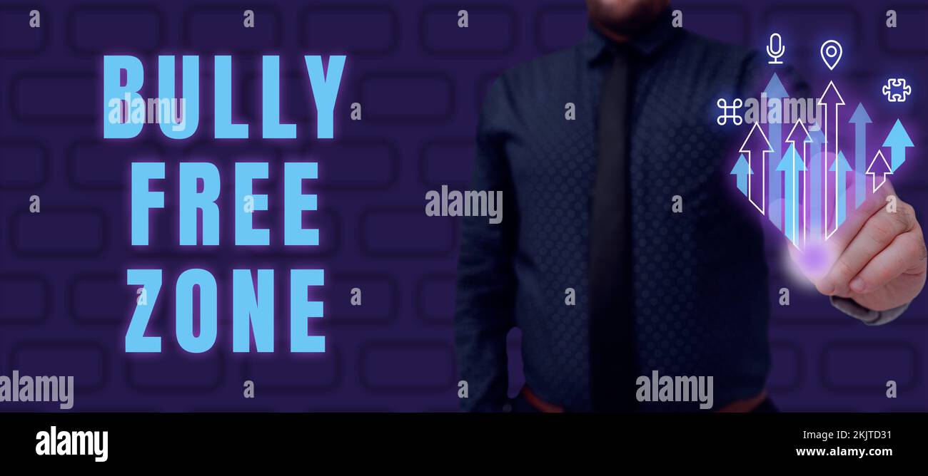 Hand writing sign Bully Free Zone. Word Written on Be respectful to ...