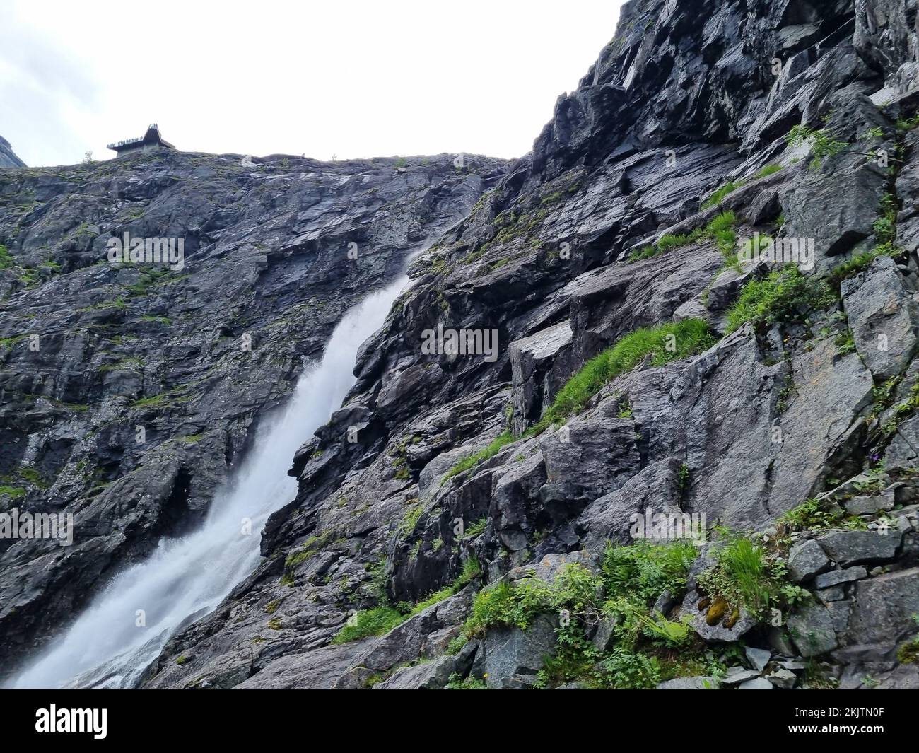 The rocky mountains covered with a huge waterfall, trollstigen, norway ...