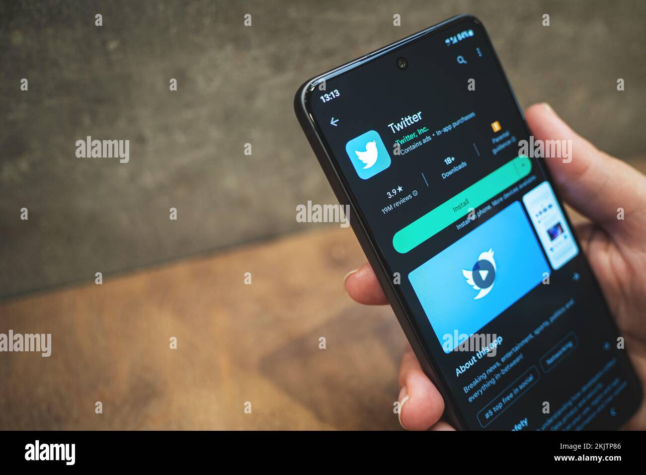 Twitter mobile app on smartphone in hand with copy space. Social media ...