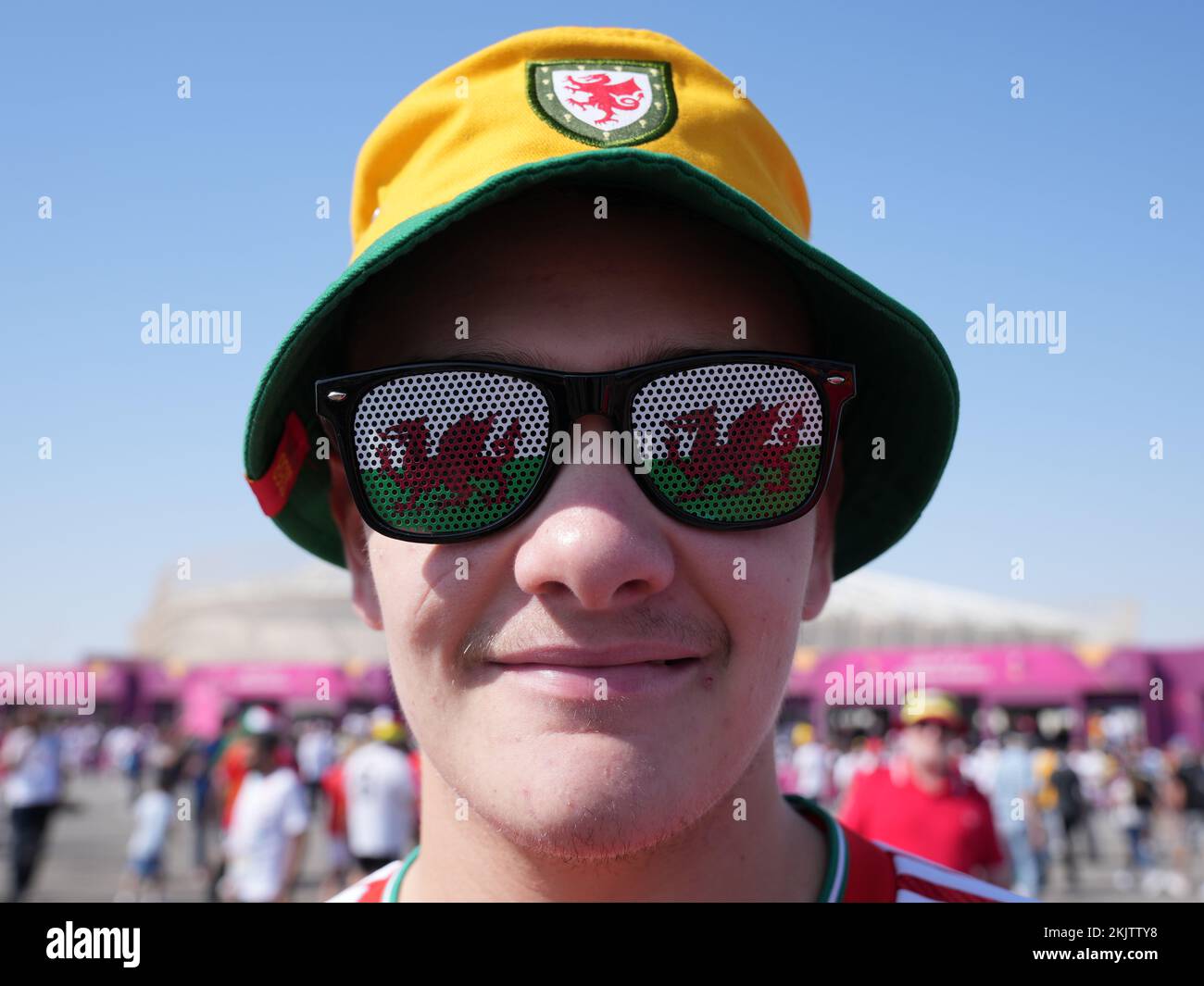 A Welsh fan pose for a photo at the Khalifa International Stadium, Doha ...