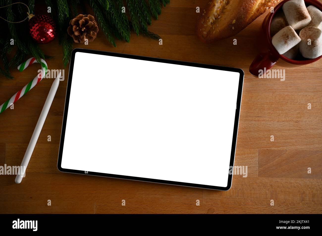 Workspace in Christmas theme, tablet white screen mockup on a wooden ...