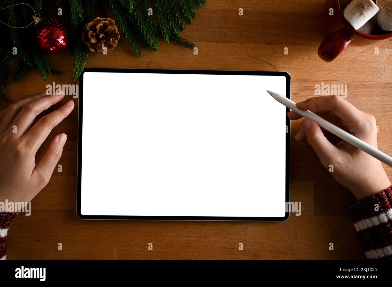 Top view, A female using stylus pen drawing on her digital tablet at ...