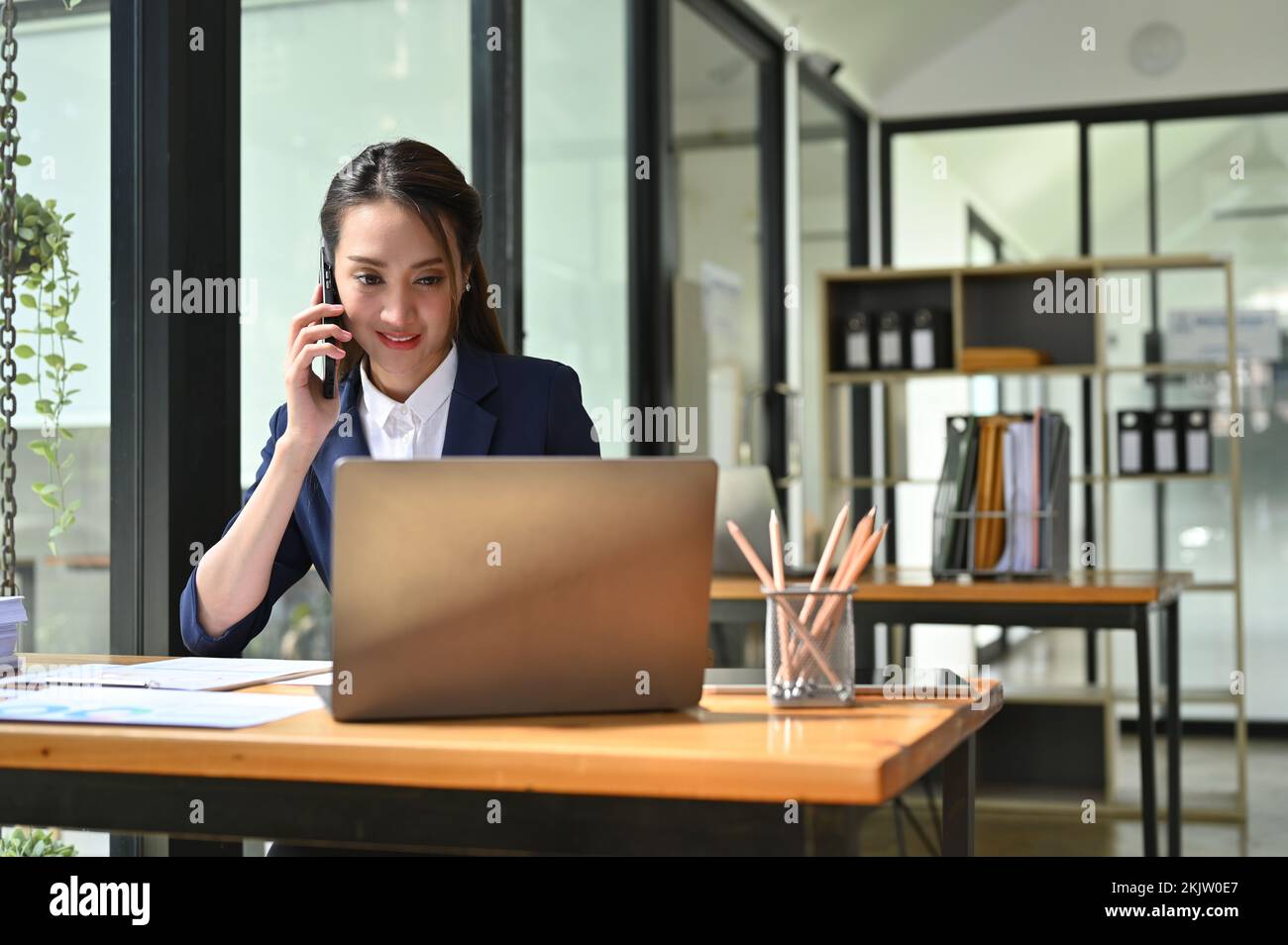 Professional millennial Asian businesswoman or female account executive ...