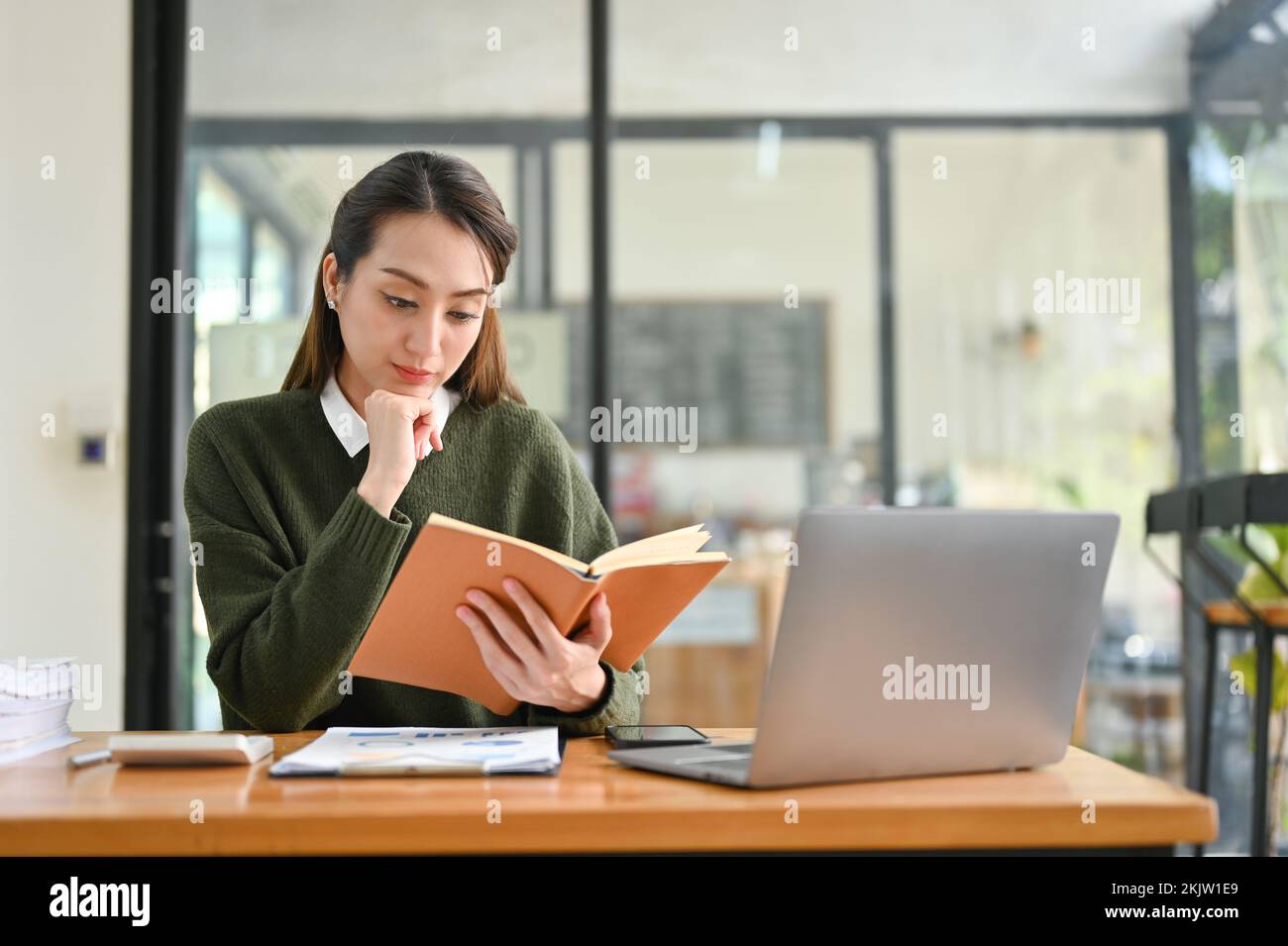 Determined and professional millennial Asian businesswoman or female ...