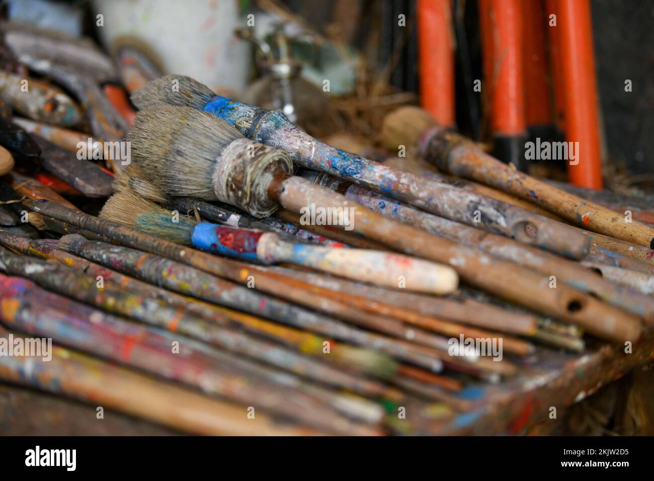 Many used dirty brushes of the artist in the workshop Stock Photo - Alamy