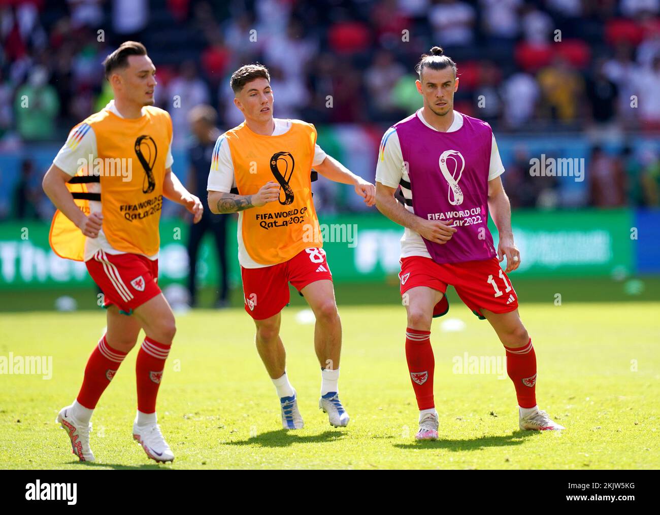 Wales' Gareth Bale (right) and Harry Wilson warm up on the pitch ahead ...