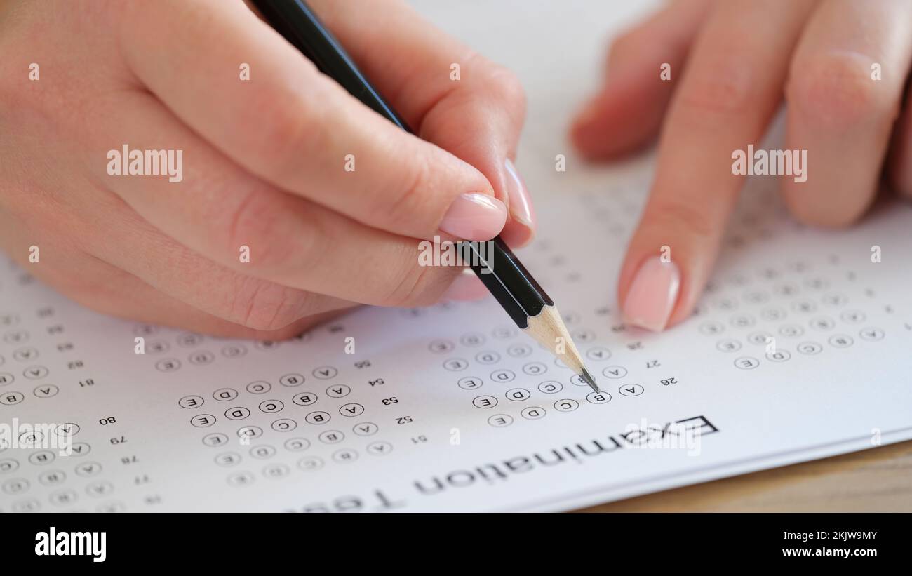 School pupil hand holding pencil hi-res stock photography and images ...