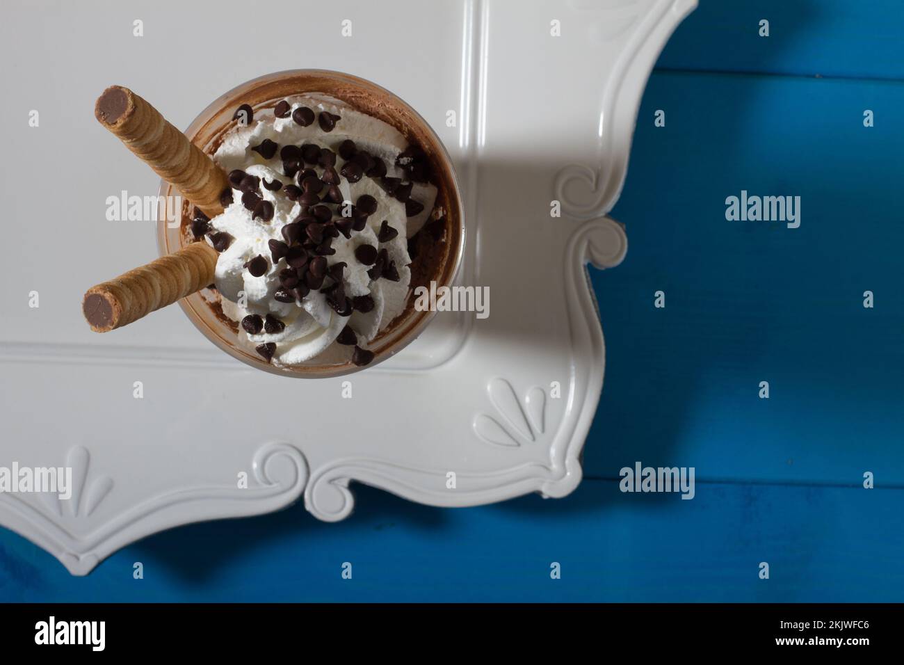 A top view of a delicious glass of chocolate milkshake with whipped ...
