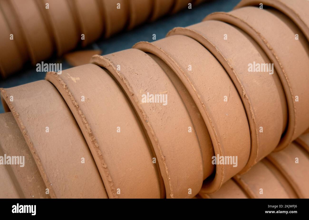A stack of unpainted clay pots Stock Photo - Alamy