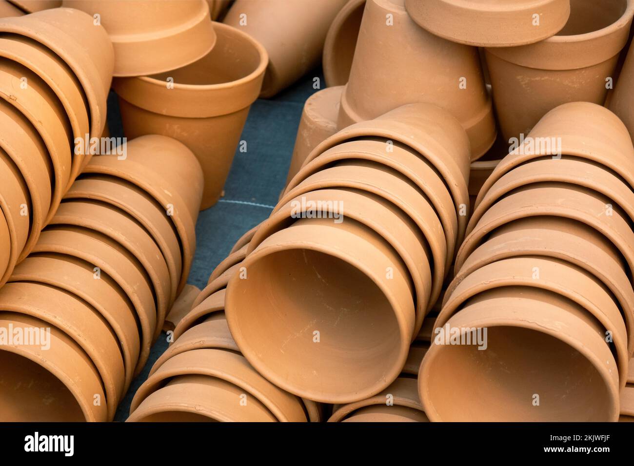 A stack of unpainted clay pots Stock Photo - Alamy
