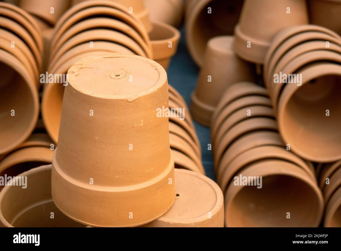 A stack of unpainted clay pots Stock Photo - Alamy