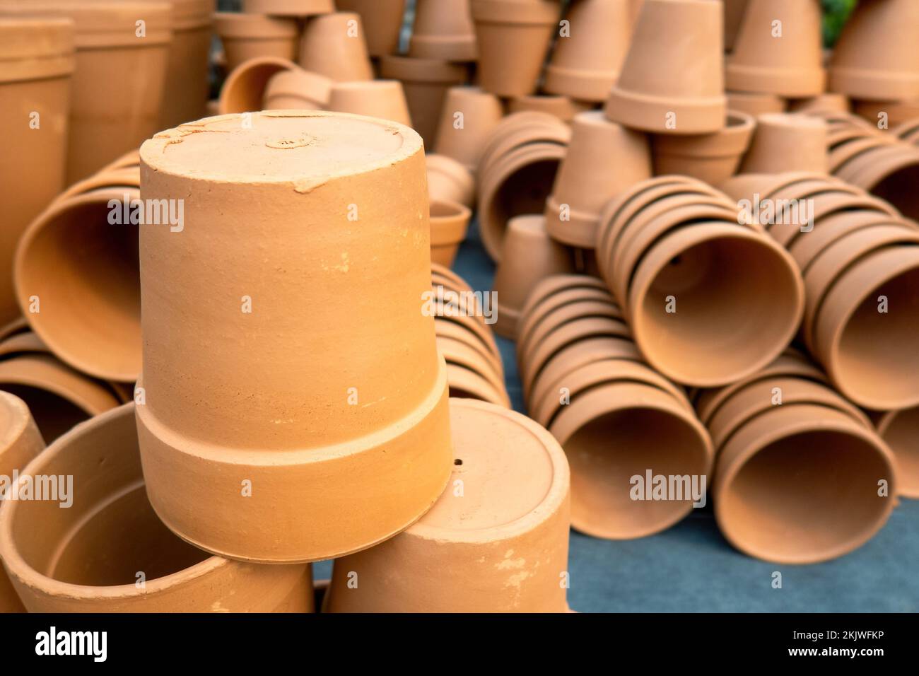 A stack of unpainted clay pots Stock Photo - Alamy