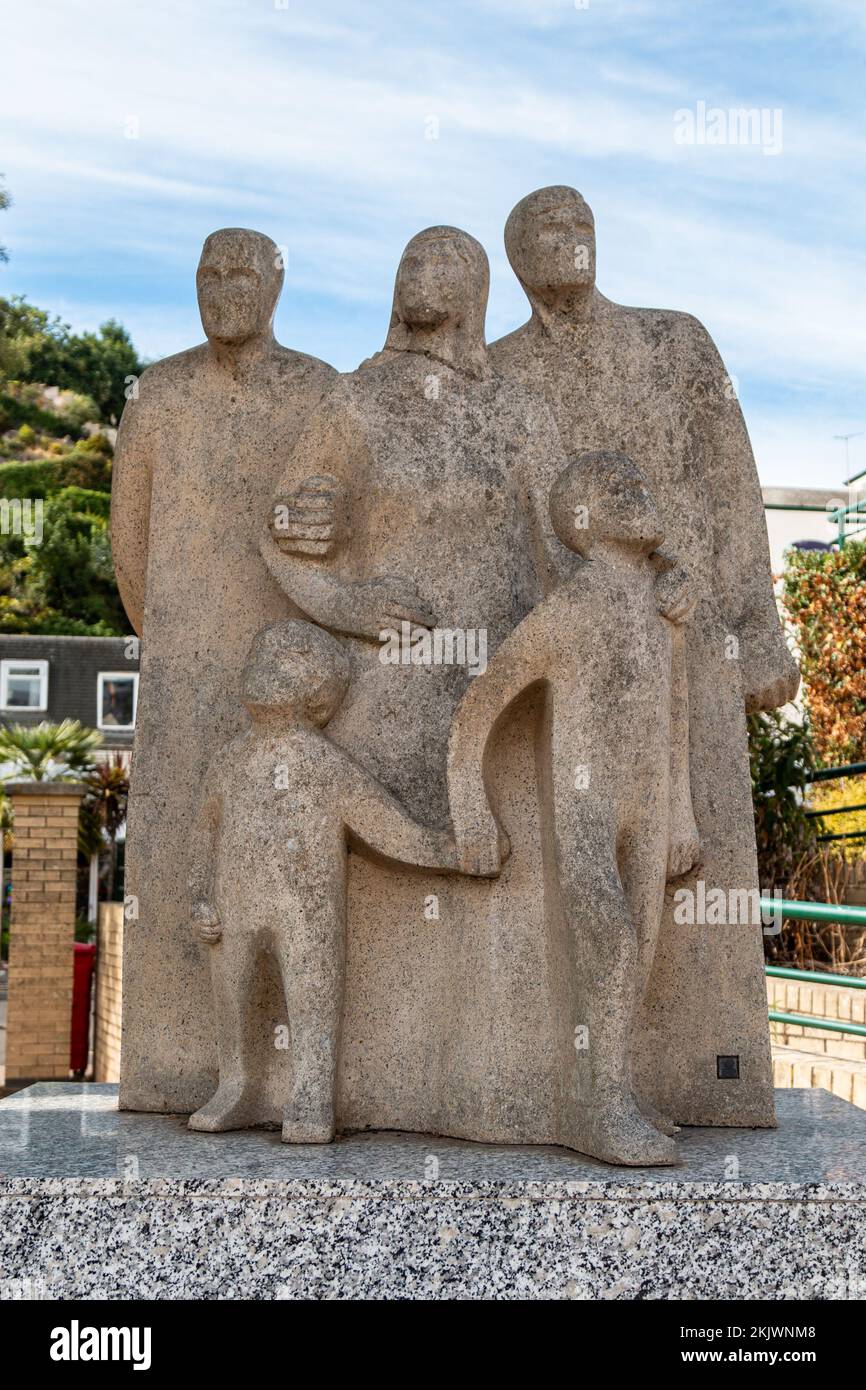 A concrete statue of a family designed in 1989 by Carole Vincent for ...