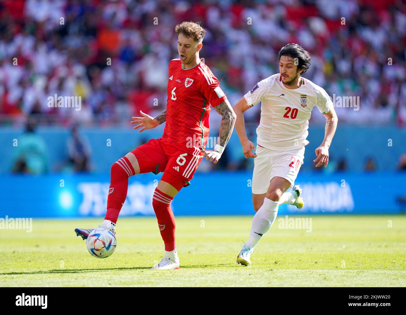 Wales' Joe Rodon (left) and Iran's Sardar Azmoun battle for the ball ...