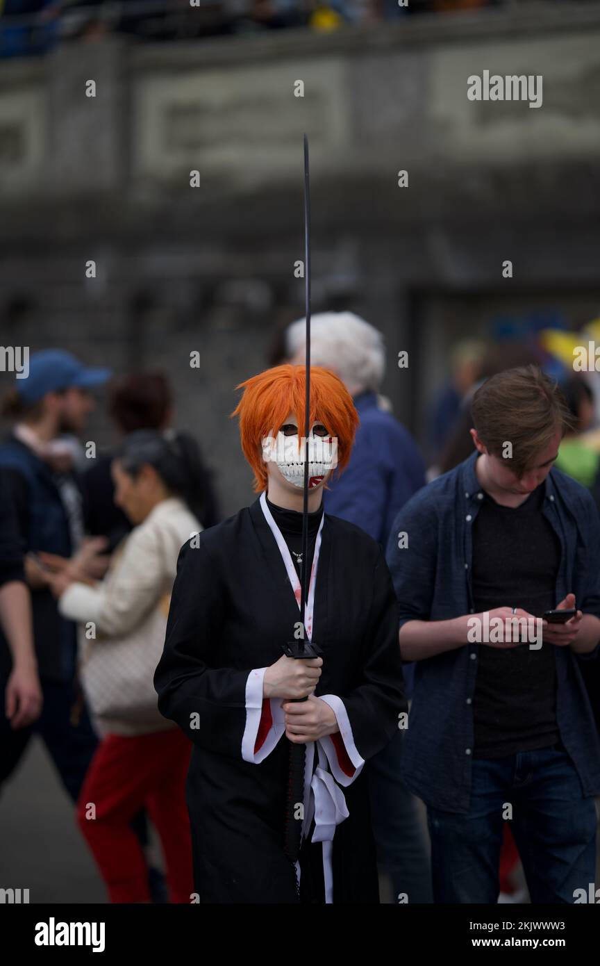 A vertical shot of a person dressed as Ichigo Kurosaki character at ...