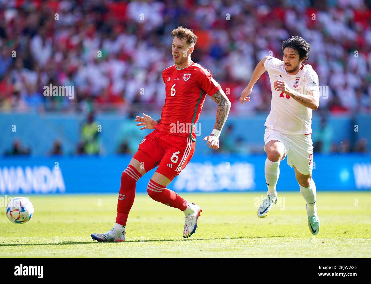 Wales' Joe Rodon (left) and Iran's Sardar Azmoun battle for the ball ...