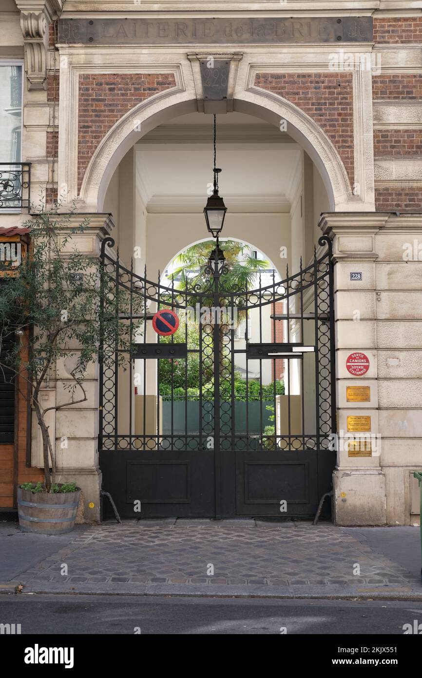A vertical shot of beautiful black gates of an aesthetic house with ...
