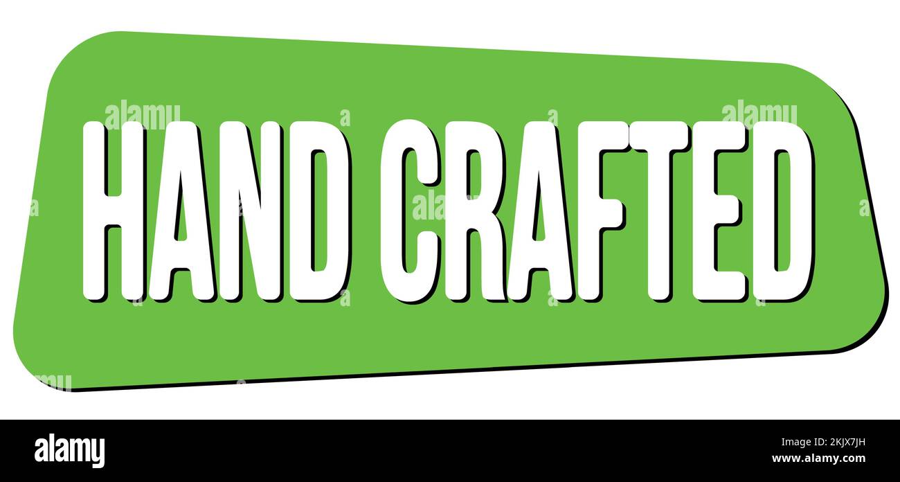 HAND CRAFTED text written on green trapeze stamp sign Stock Photo - Alamy