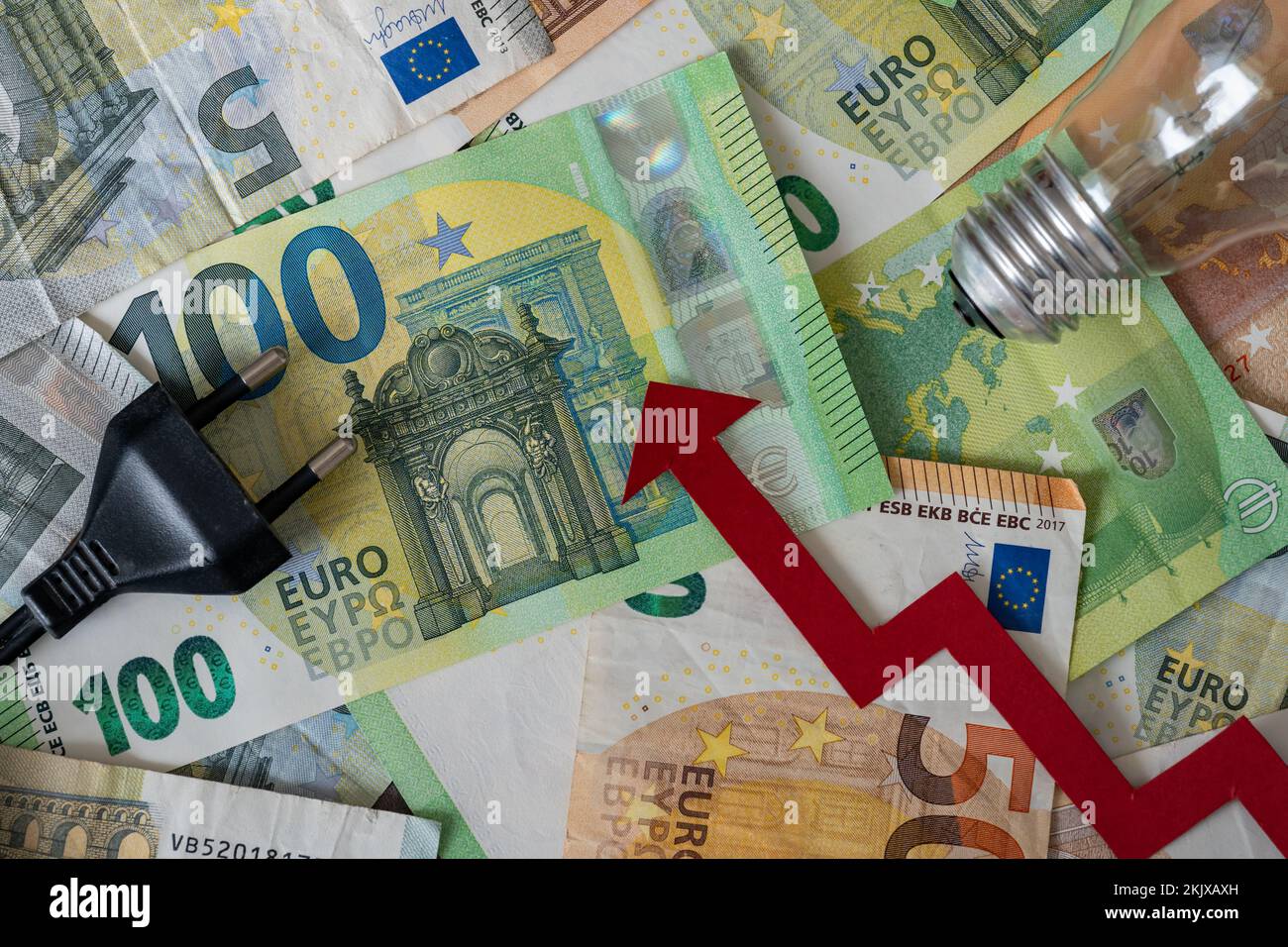 The concept of electricity inflation in Europe - red arrow, lamp, and a ...