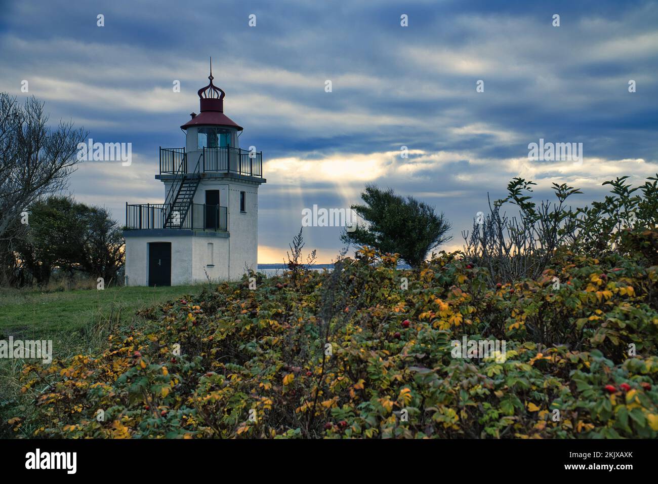 Lighthouse, Spodsbjerg Fyr in Huntsted on the coast of Denmark. Sun ...