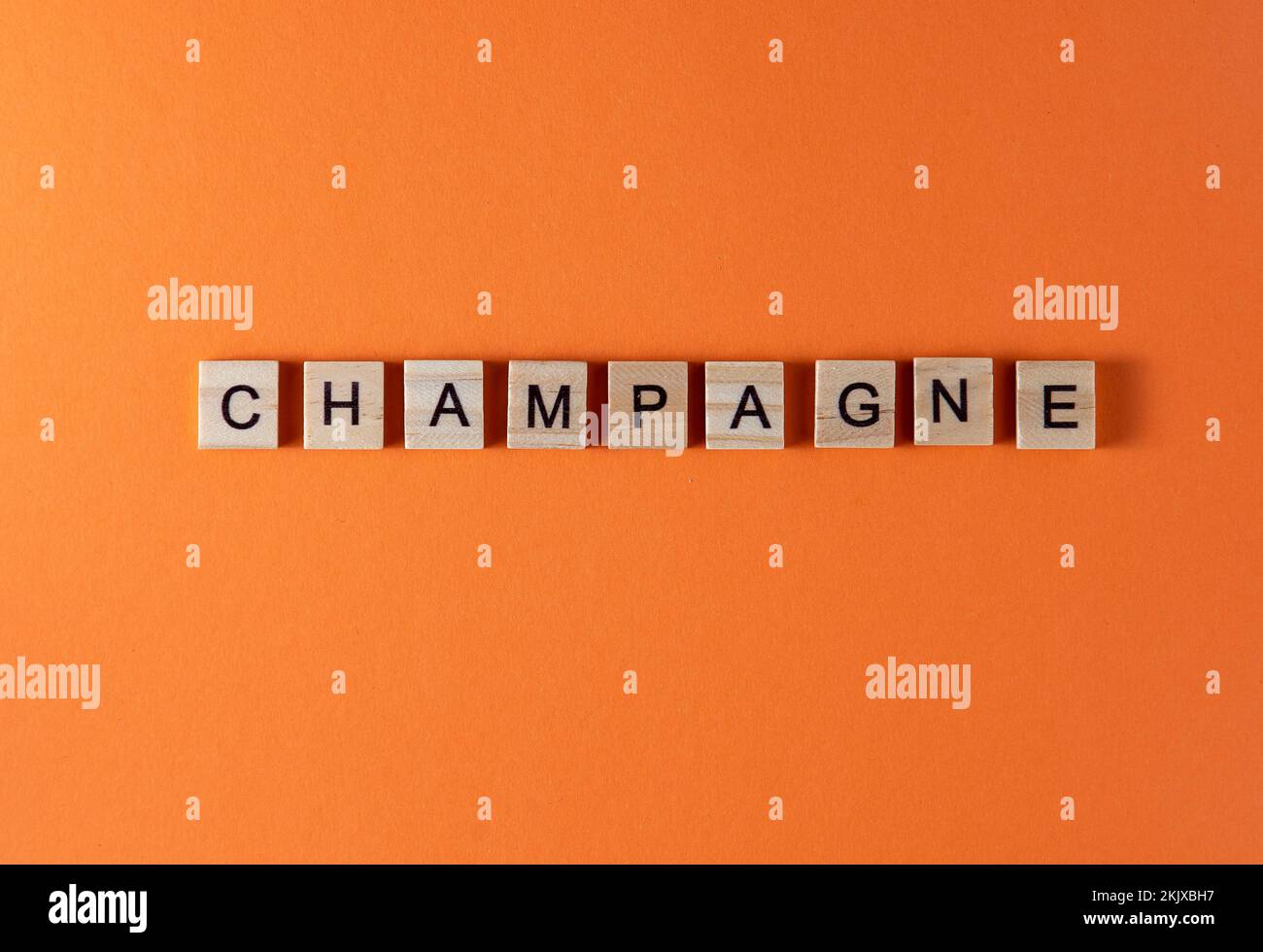 Champagne word phrase in wooden letters. Motivation and slogan. Orange ...