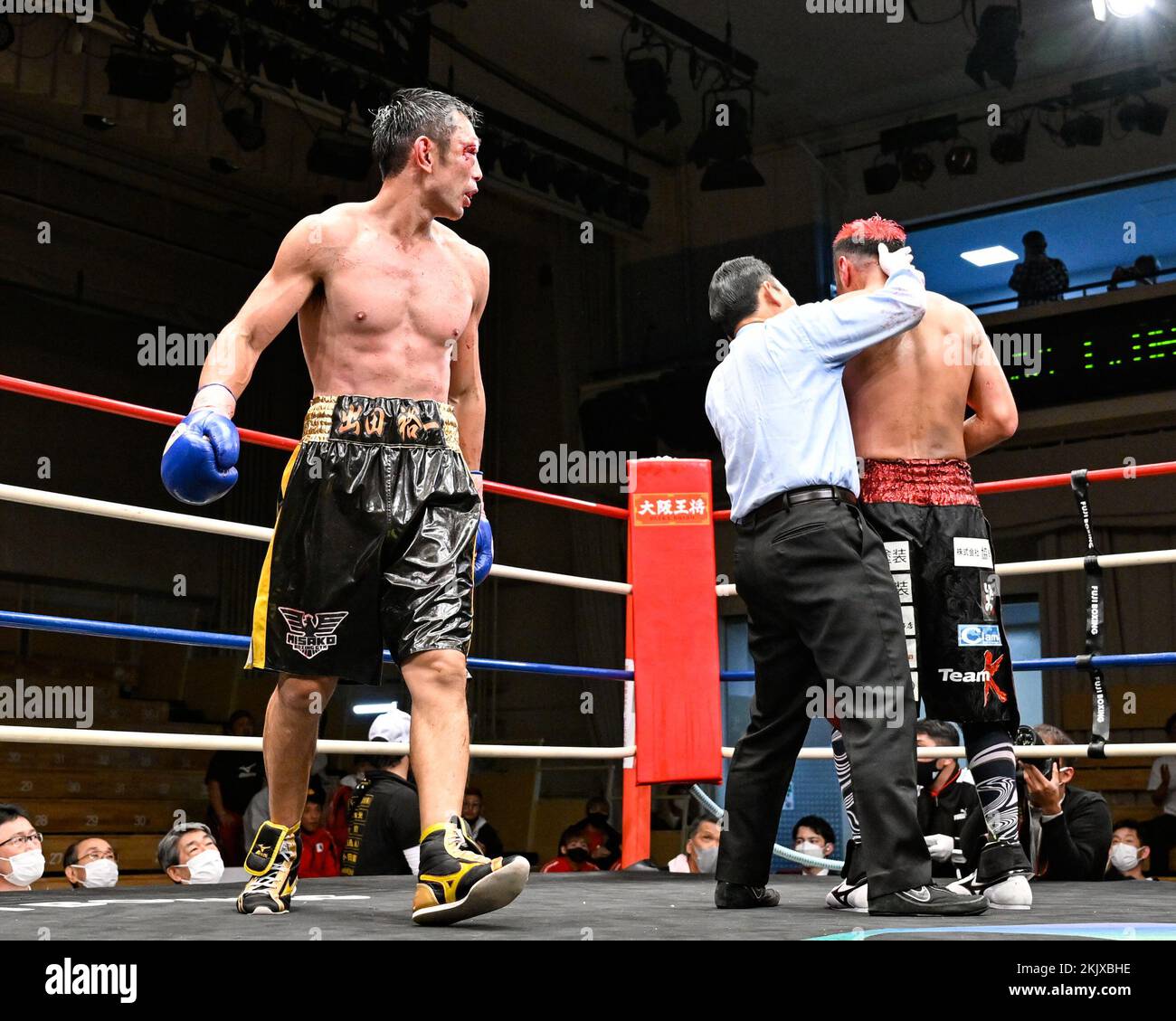 Referee Takeru Okaniwa stops the fight in the ninghth round during the ...