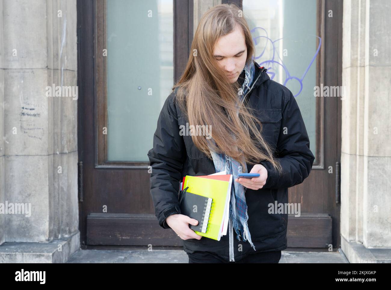 Boy student speaking phone Stock Photo - Alamy
