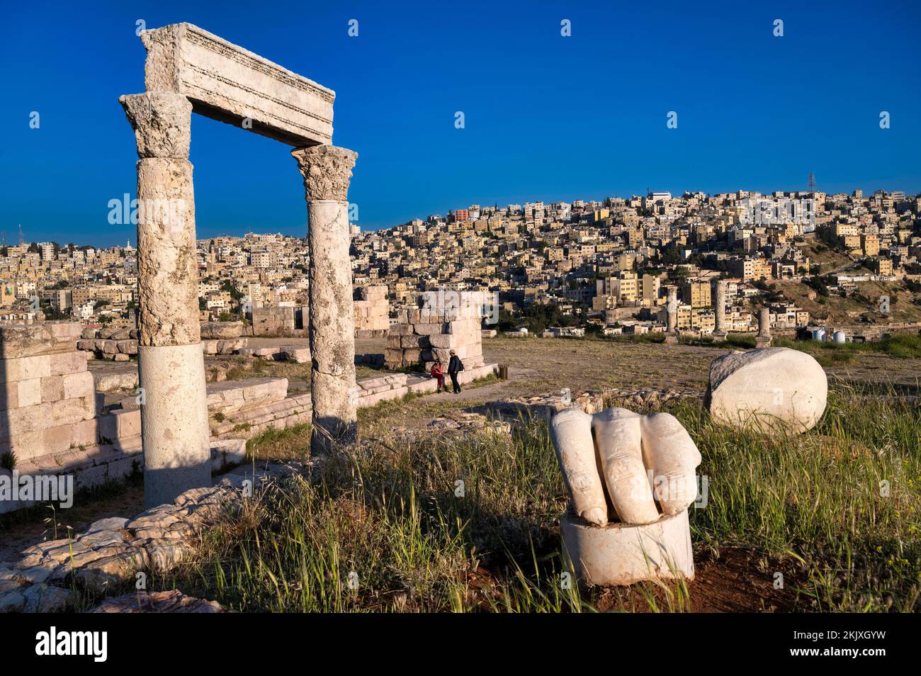 Temple of Hercules, Amman Citadel, Jordan. An unknown couple rests on ...
