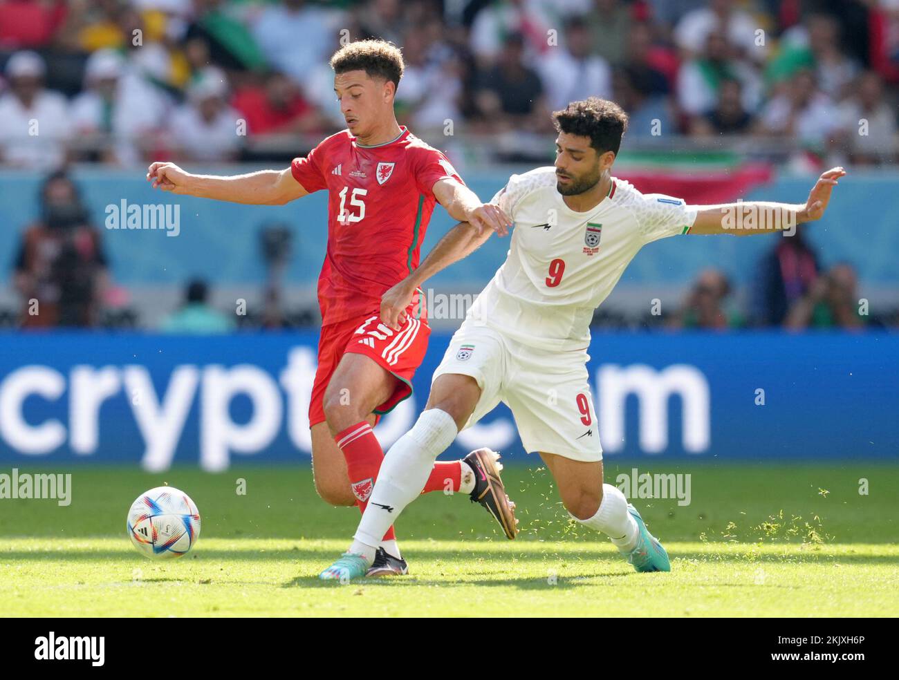 Wales' Ethan Ampadu (left) and Iran's Mehdi Taremi battle for the ball ...