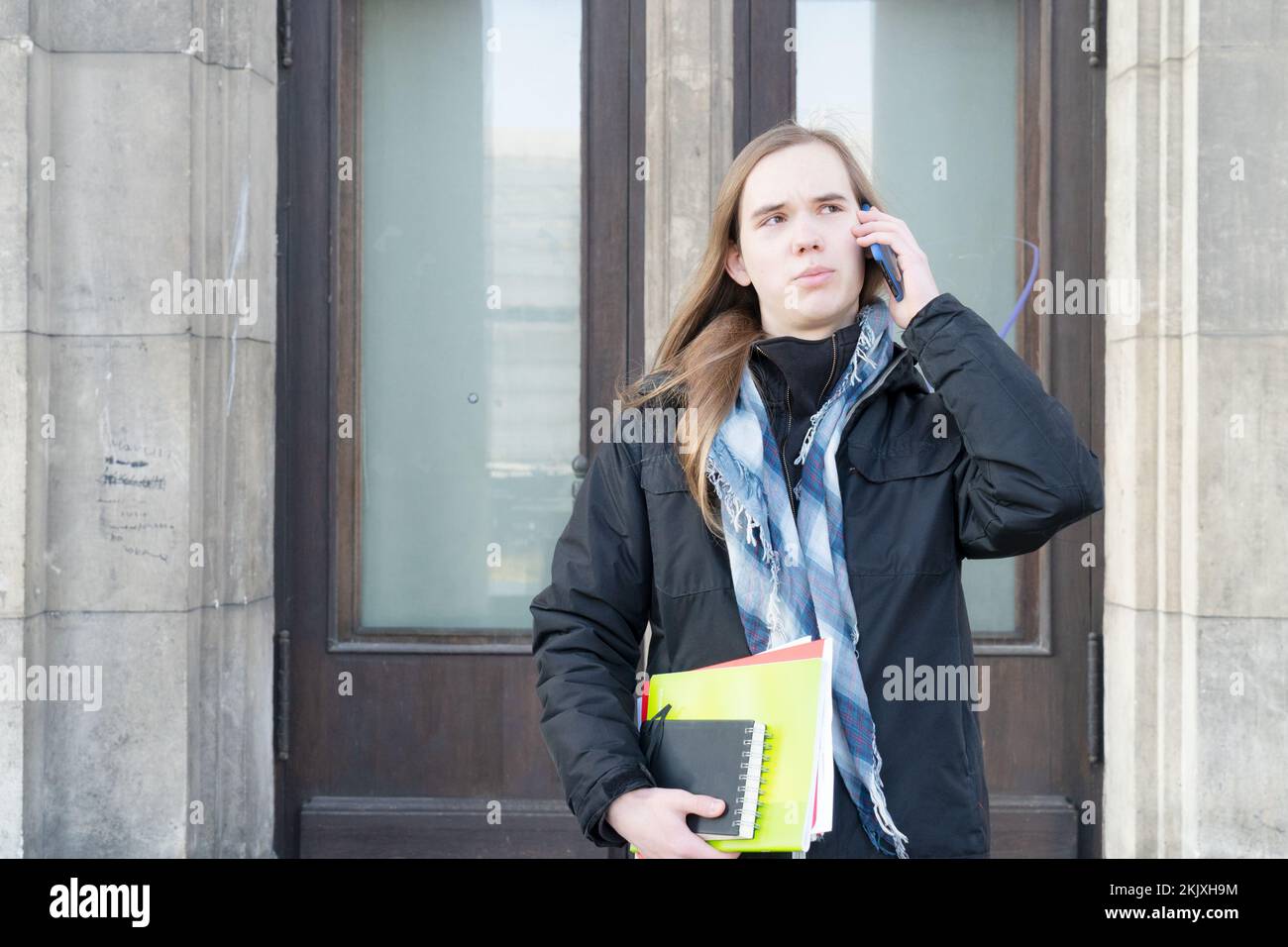 Boy student speaking phone Stock Photo - Alamy