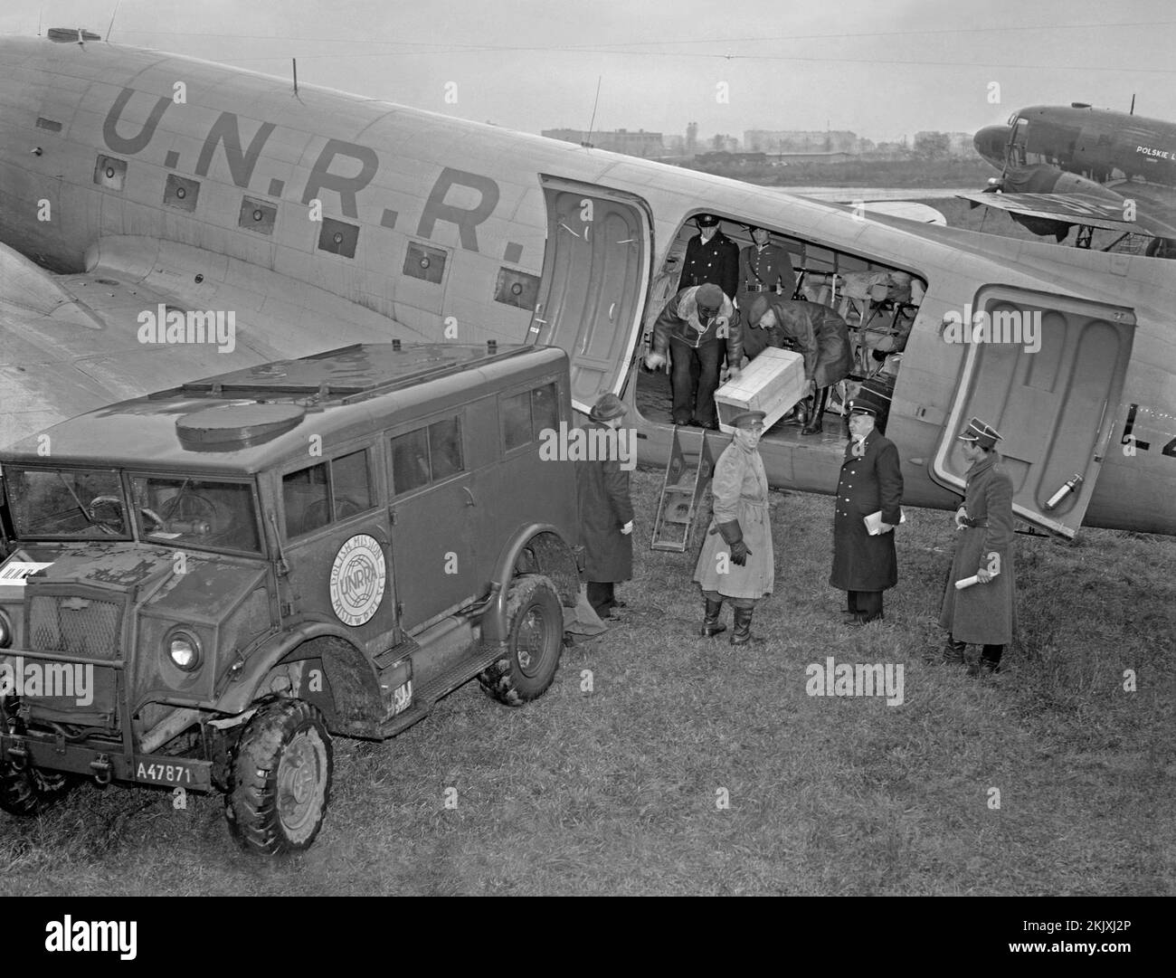 Unloading relief supplies provided by UNRRA at Warsaw, Poland in 1946 ...