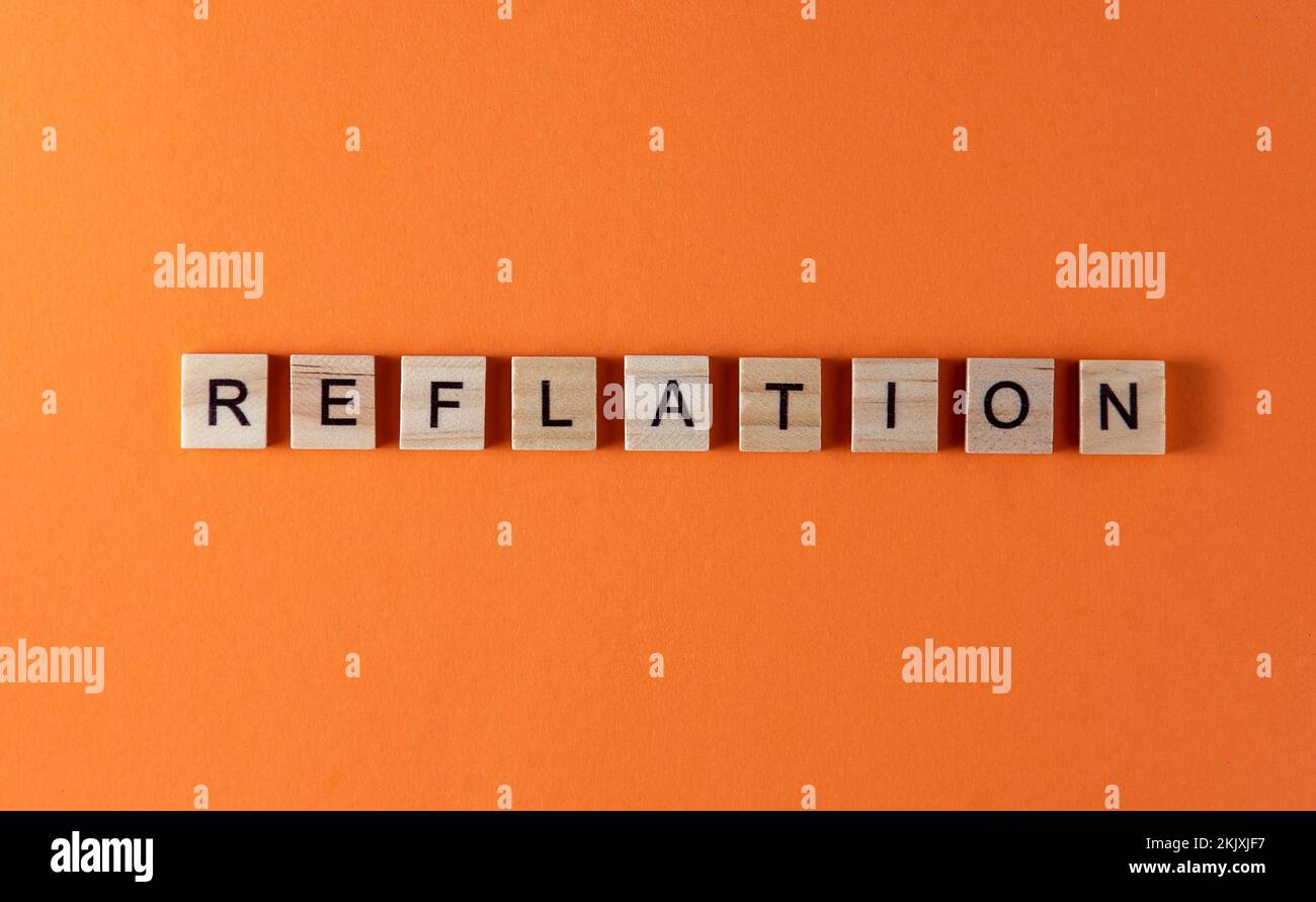 Reflation word phrase in wooden letters. Motivation and slogan. Orange ...